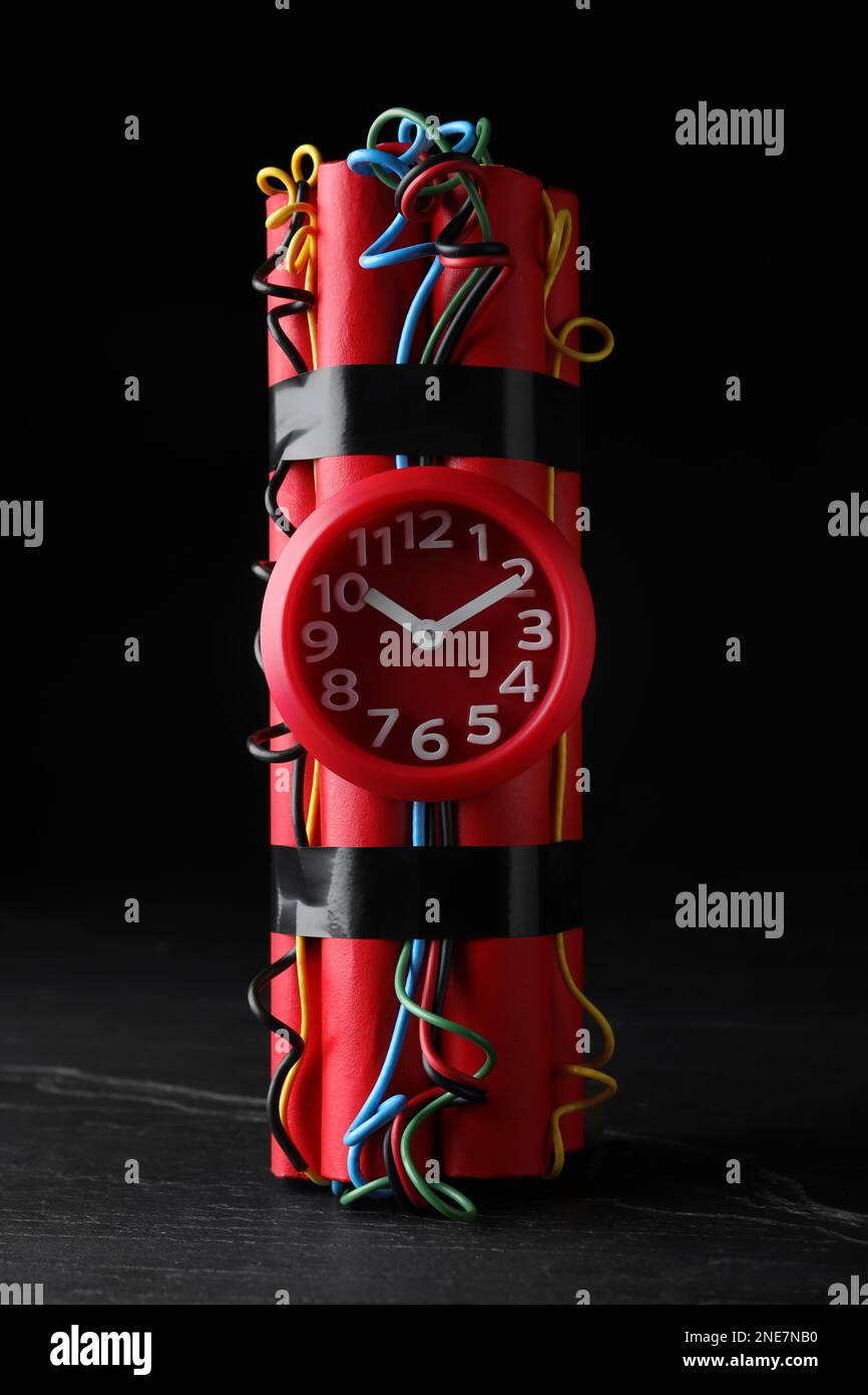 Explosive dynamite time bomb on black background Stock Photo - Alamy