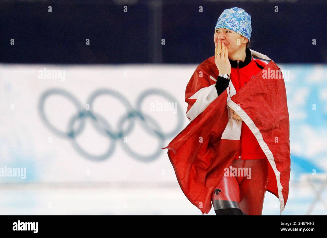 Bronze medallist Canada's Clara Hughes reacts after the women's 5,000 meters race at the ...
