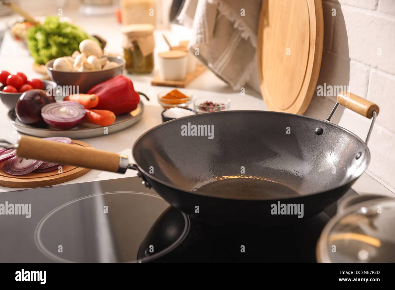 Frying pan with cooking oil on stove Stock Photo - Alamy