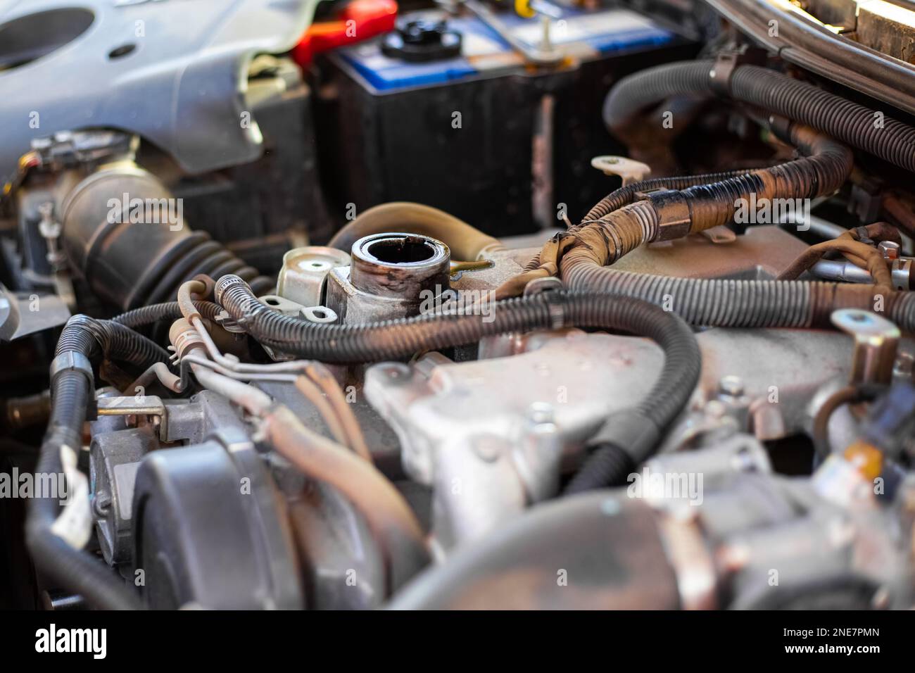 The upper part of the car engine with an open neck for pouring oil ...