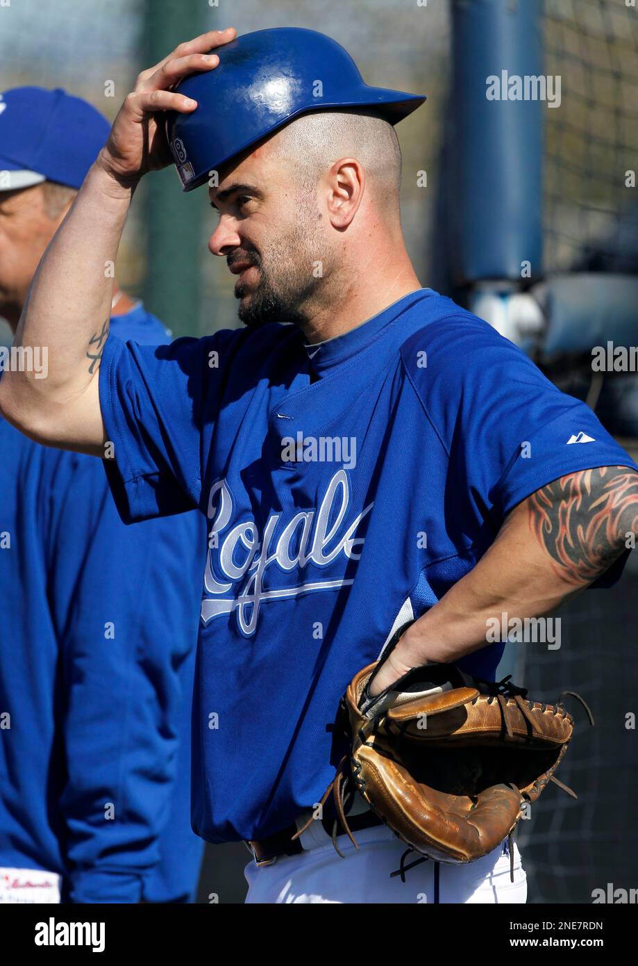 Kansas City Royals catcher Jason Kendall puts his helmet on during a ...