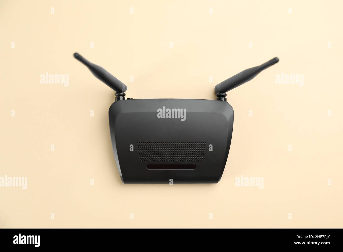 Modern Wi-Fi router on beige background, top view Stock Photo - Alamy