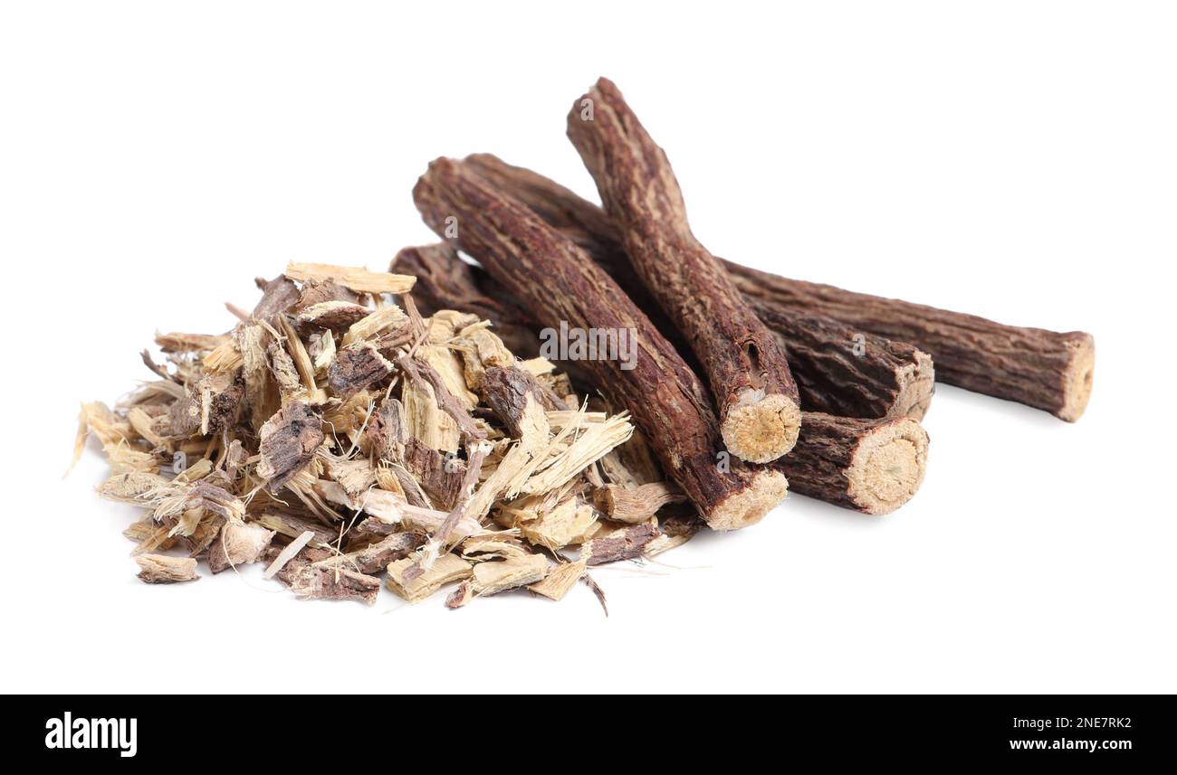 Dried sticks of liquorice root and shavings on white background Stock ...