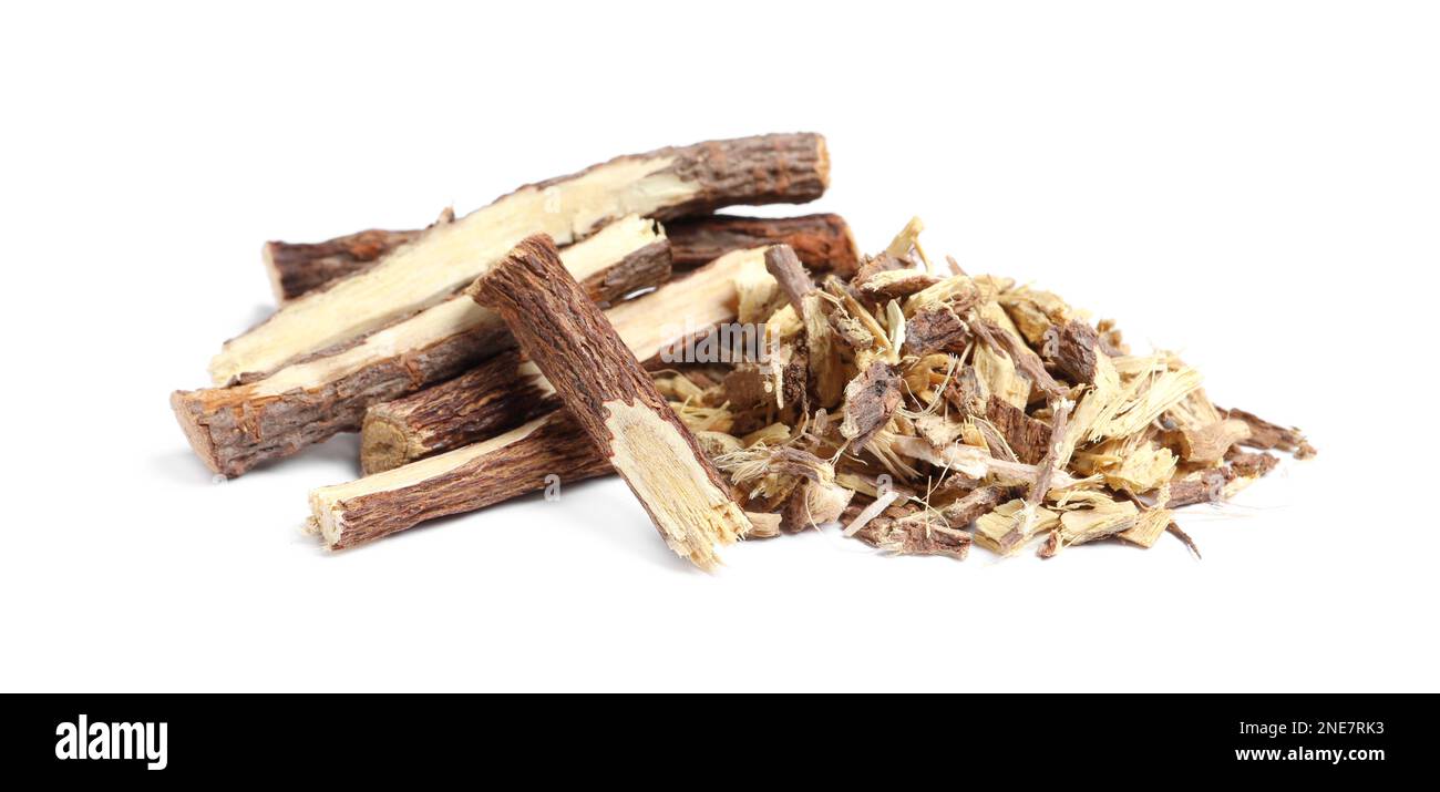 Dried sticks of liquorice root and shavings on white background Stock ...