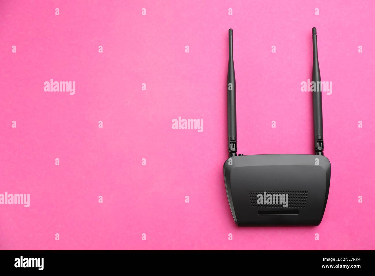 Modern Wi-Fi router on pink background, top view. Space for text Stock ...