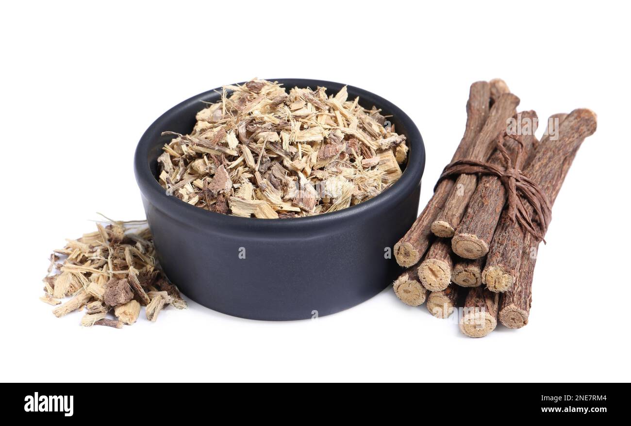 Dried sticks of liquorice root and shavings on white background Stock ...