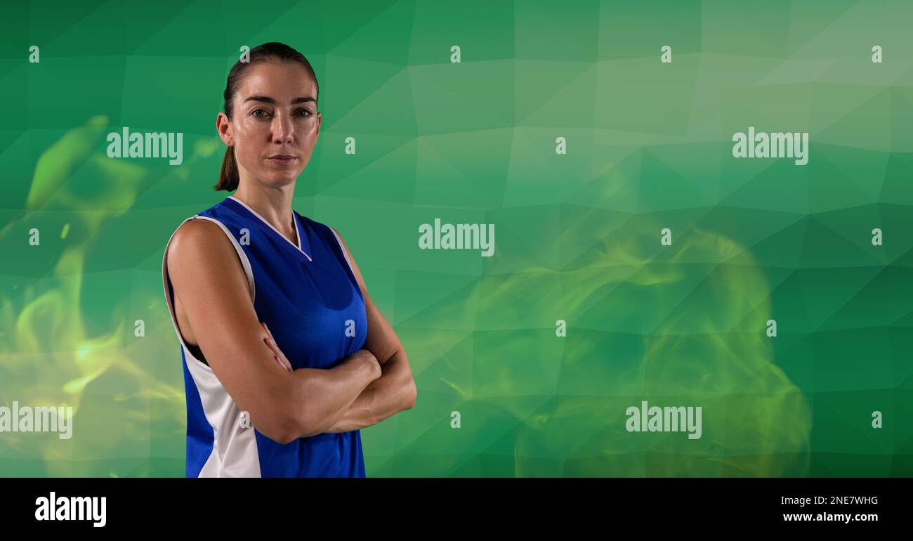 Composition of female basketball player standing with arms crossed ...