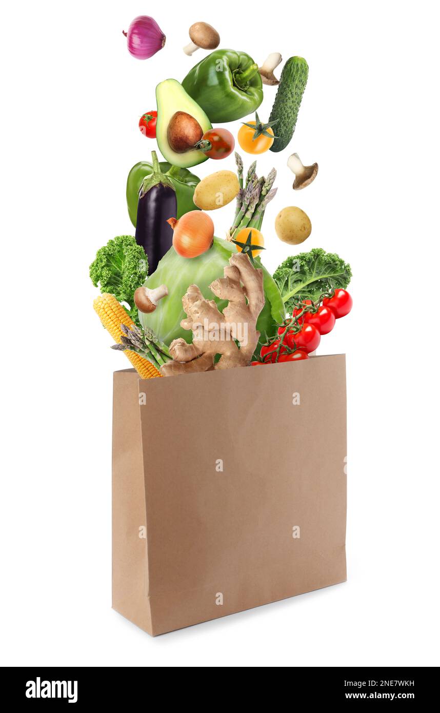Paper bag with vegetables on white background. Vegetarian food Stock ...
