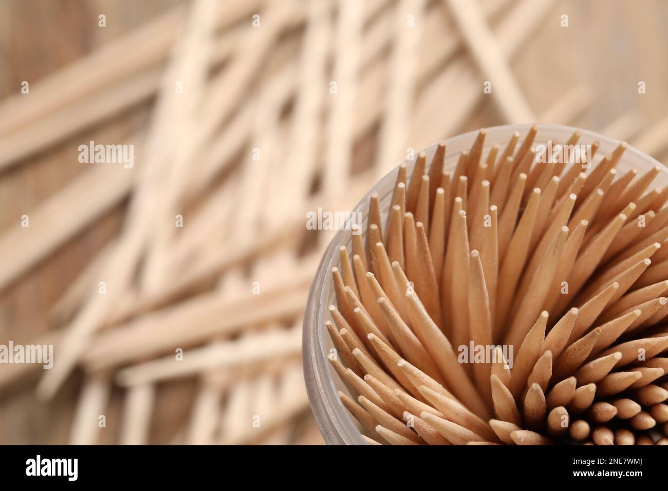 Wooden toothpicks in holder, closeup. Space for text Stock Photo - Alamy