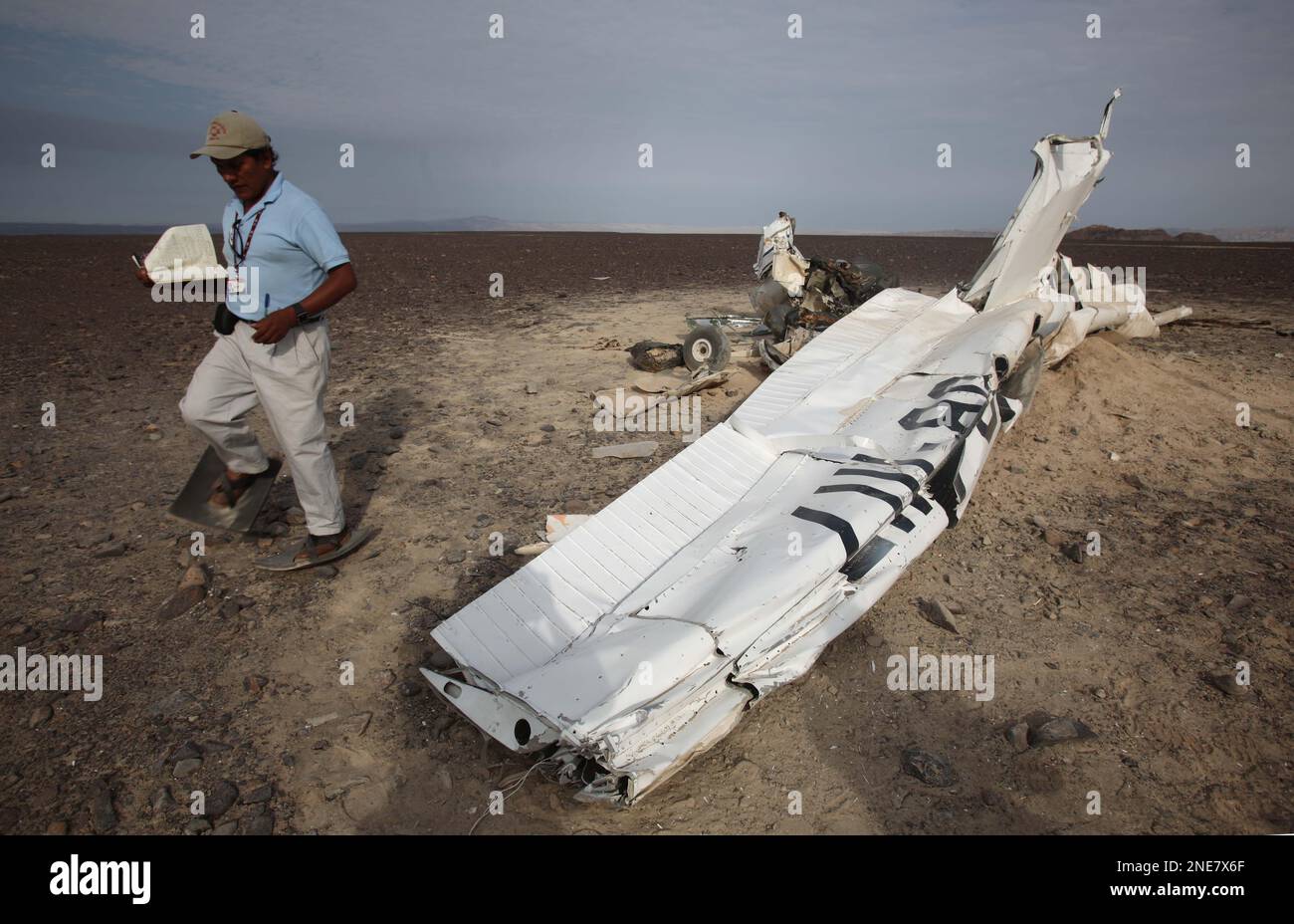 An employee of Peru's National Institute of Culture walks next to the ...