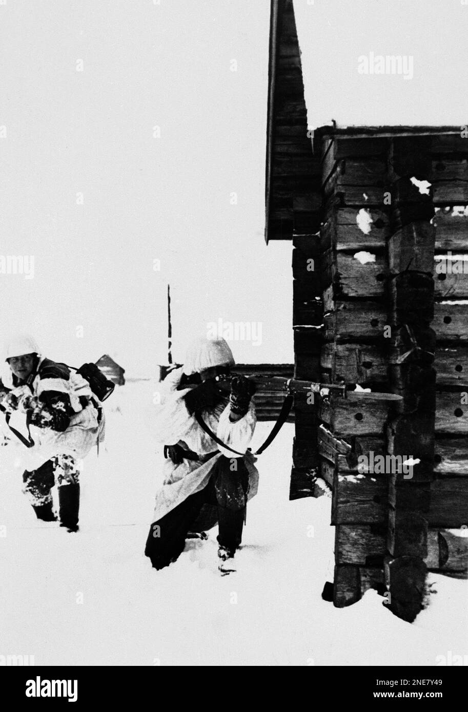Nazi soldiers, wearing their snow-camouflage suits which render them ...