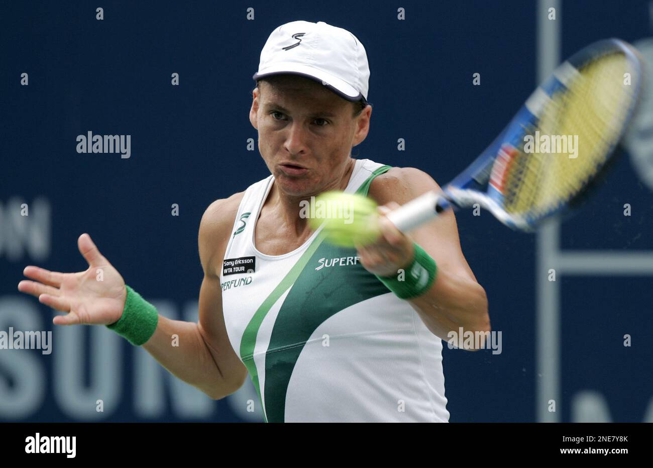 Sybille Bammer of Austria returns the ball to Chang Kai-chen of Taiwan ...