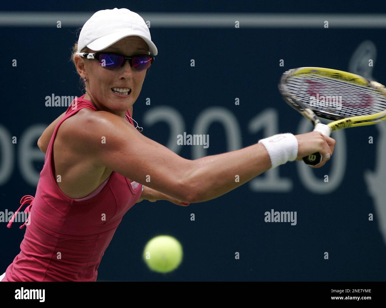 Anastasia Rodionova of Australia returns the ball to Alisa Kleybanova ...
