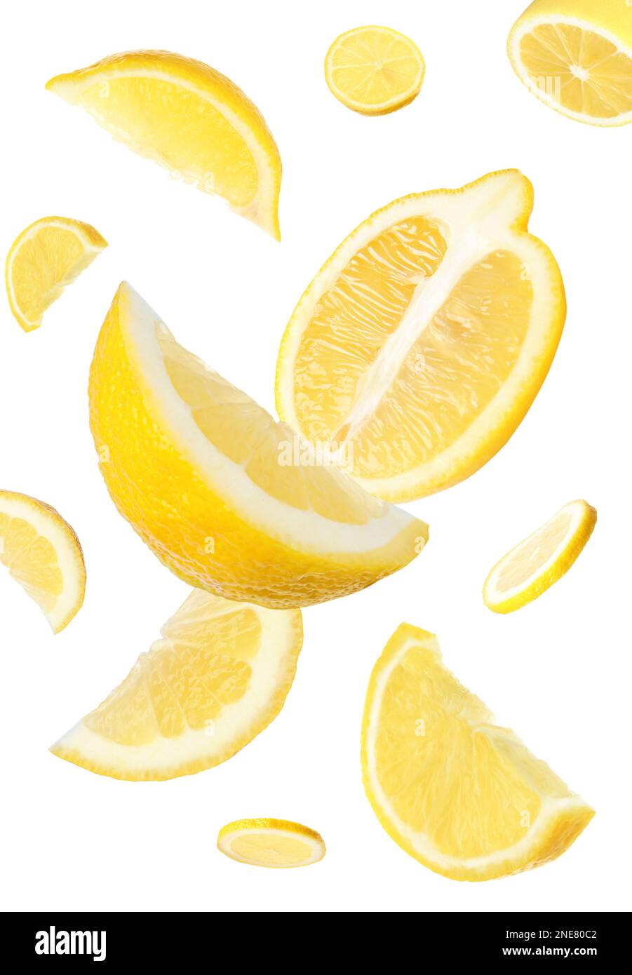 Fresh cut lemons flying on white background Stock Photo - Alamy