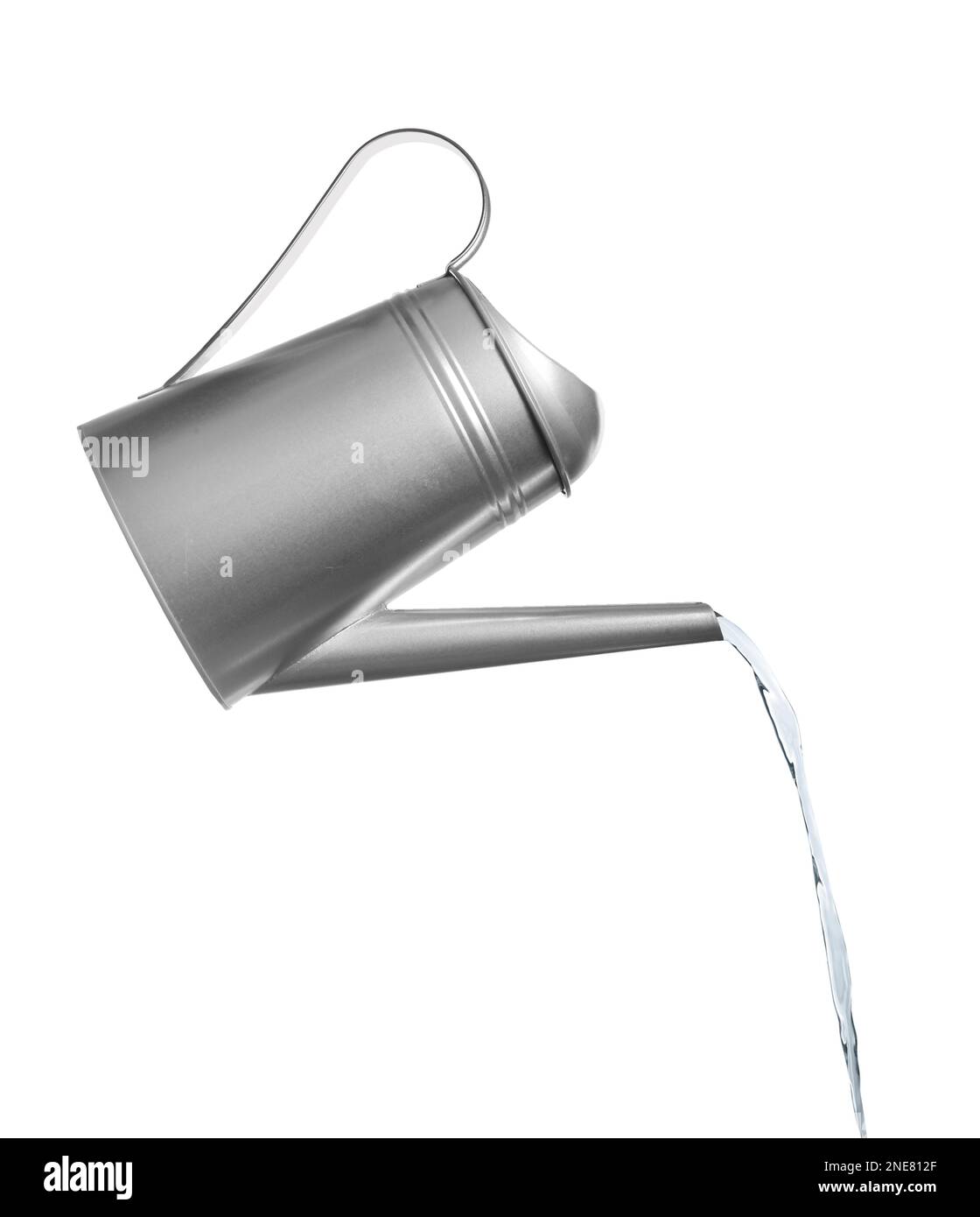 Pouring liquid from watering can on white background Stock Photo - Alamy