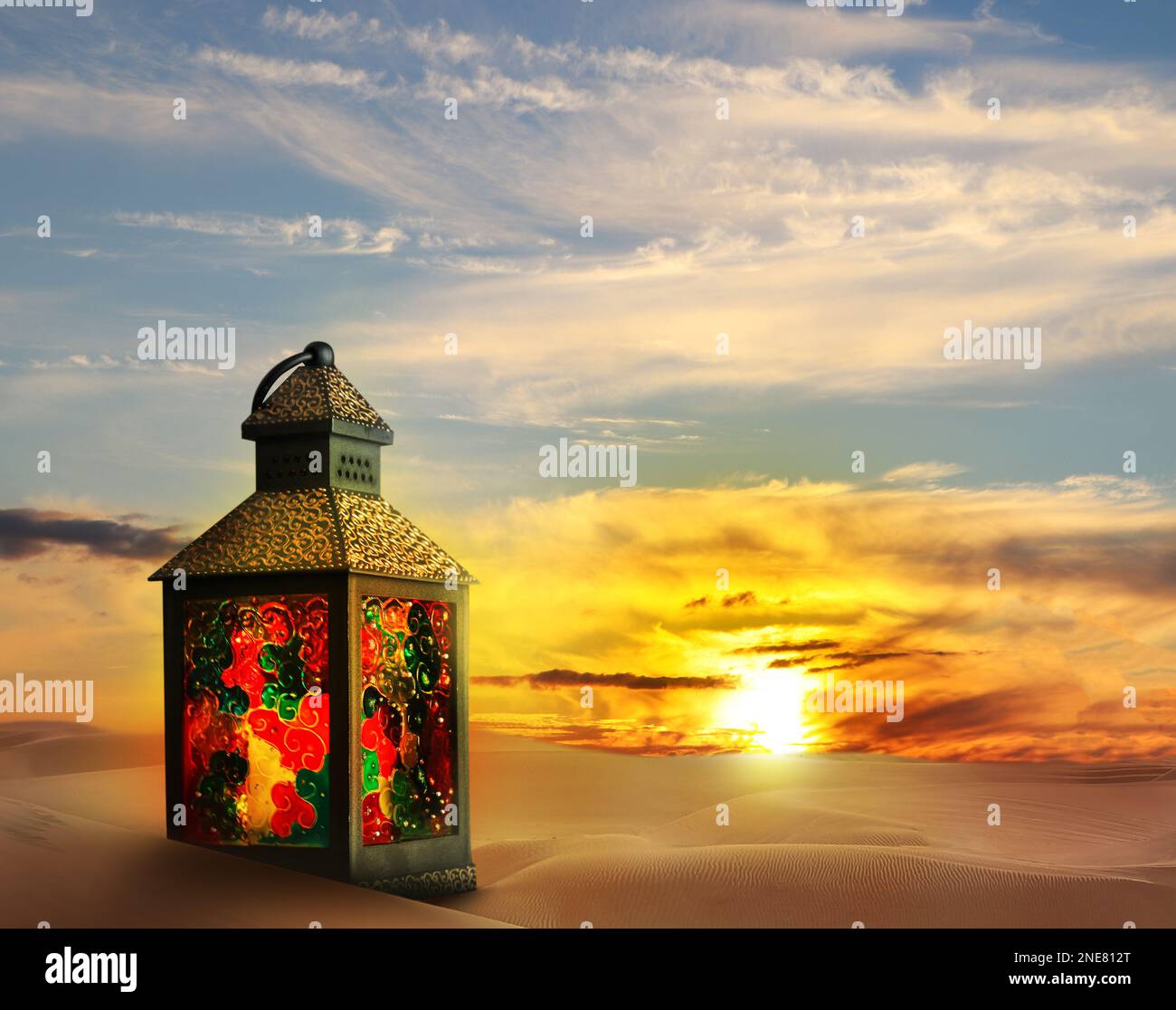 Beautiful Arabic lantern on sand at sunrise, space for text Stock Photo ...