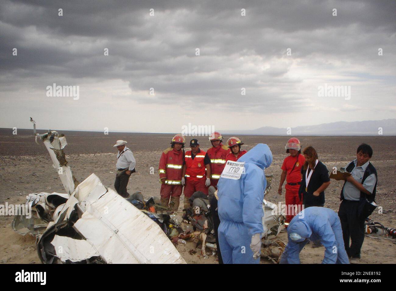 ** EDS NOTE GRAPHIC CONTENT ** Firefighters observe the remains of a ...