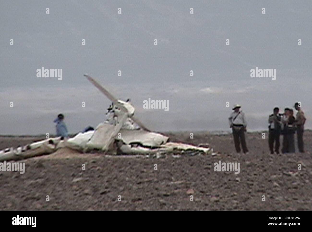 Police officers take notes next to the remains of a plane crashed in ...