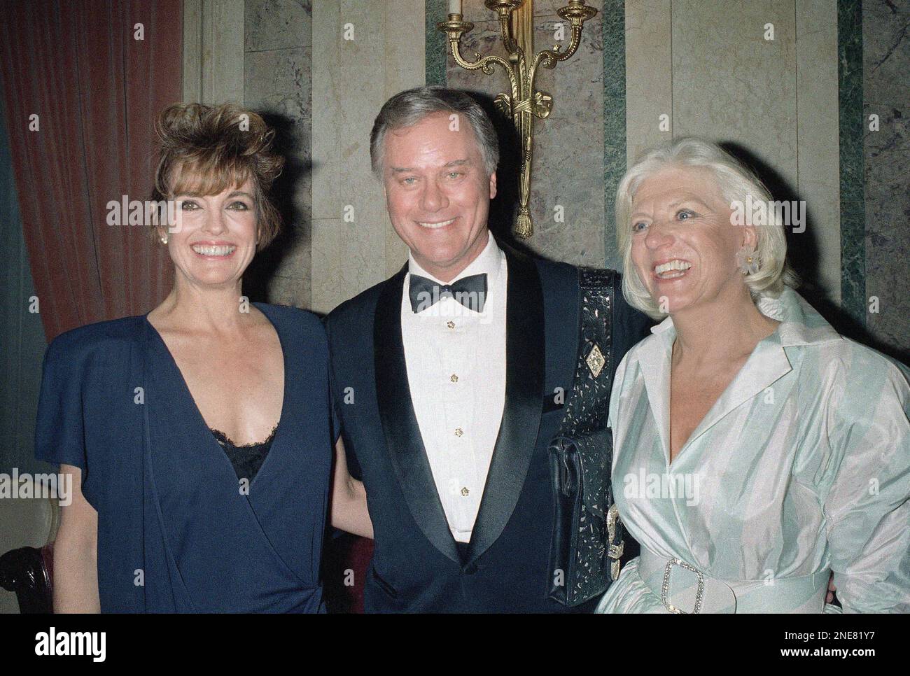 Actor Larry Hagman is joined by actress Linda Gray, left, and his wife ...