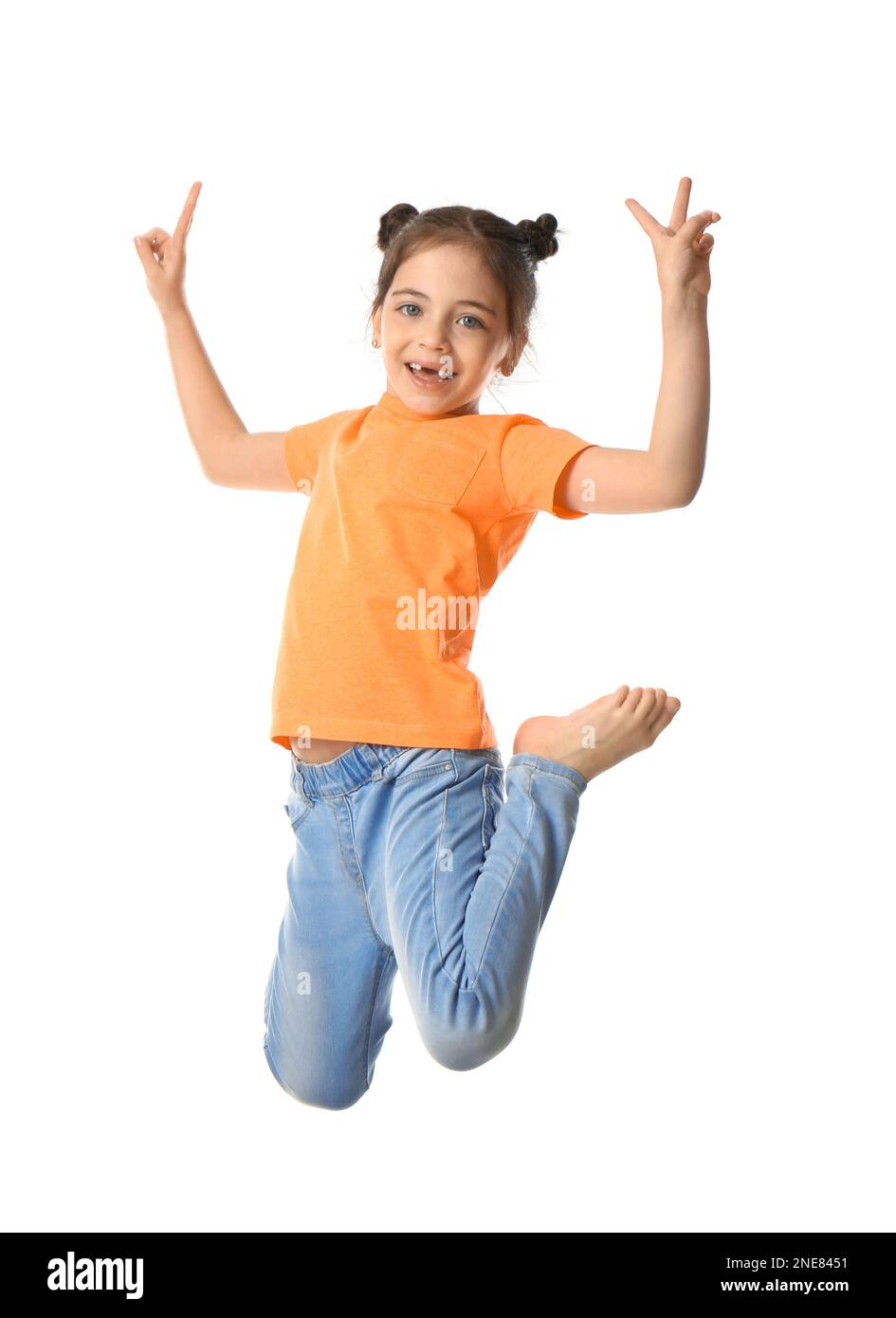 Cute little girl jumping on white background Stock Photo - Alamy
