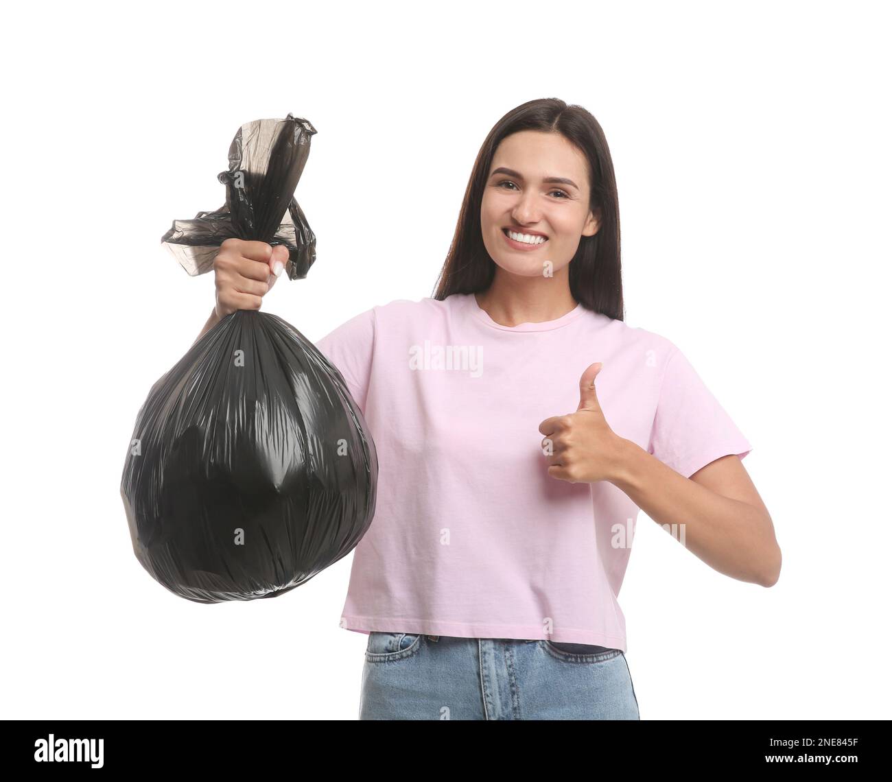 Woman holding full garbage bag on white background Stock Photo - Alamy