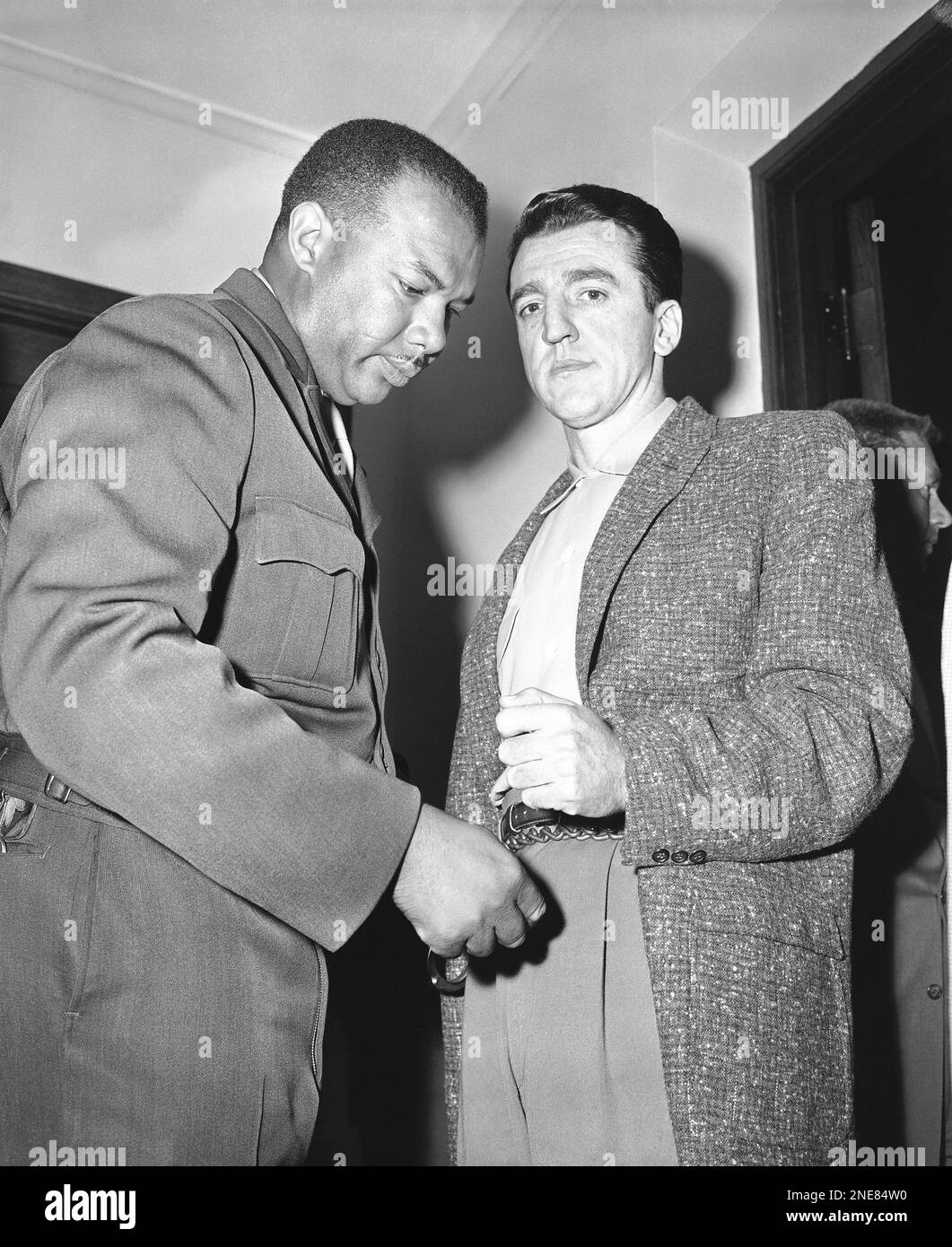 E.N. Hatton, a San Quentin prison guard, removes chains from Caryl ...