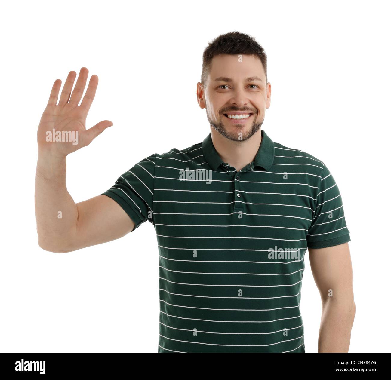 Cheerful man waving to say hello on white background Stock Photo - Alamy