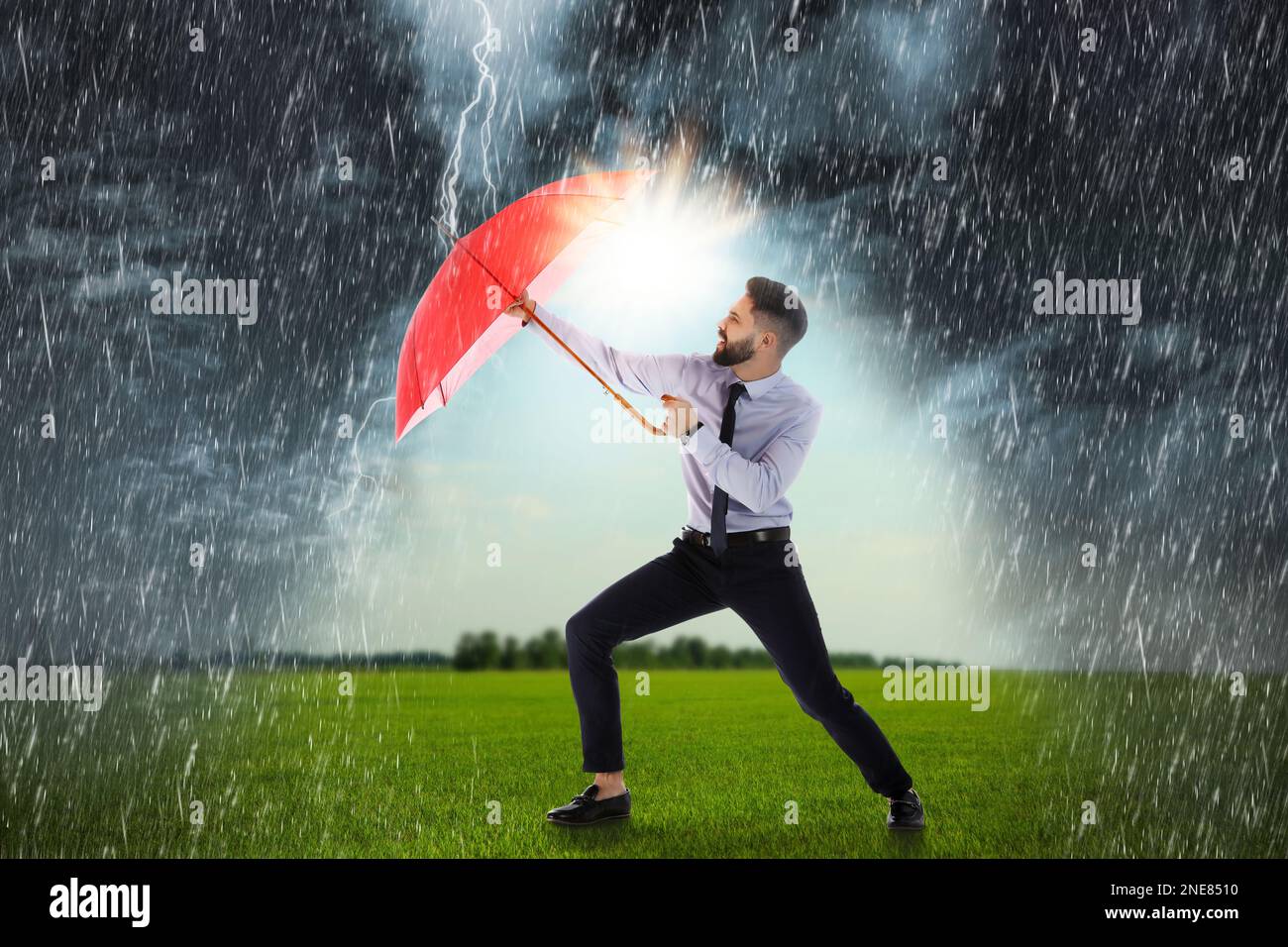 Man heavy rain hiding hi-res stock photography and images - Alamy