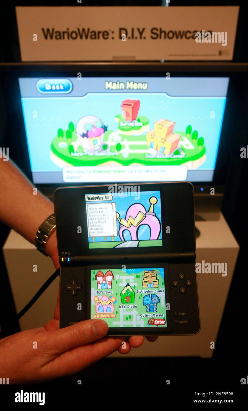 WarioWare D.I.Y. is shown on the Nintendo DSi XL hand held system ...