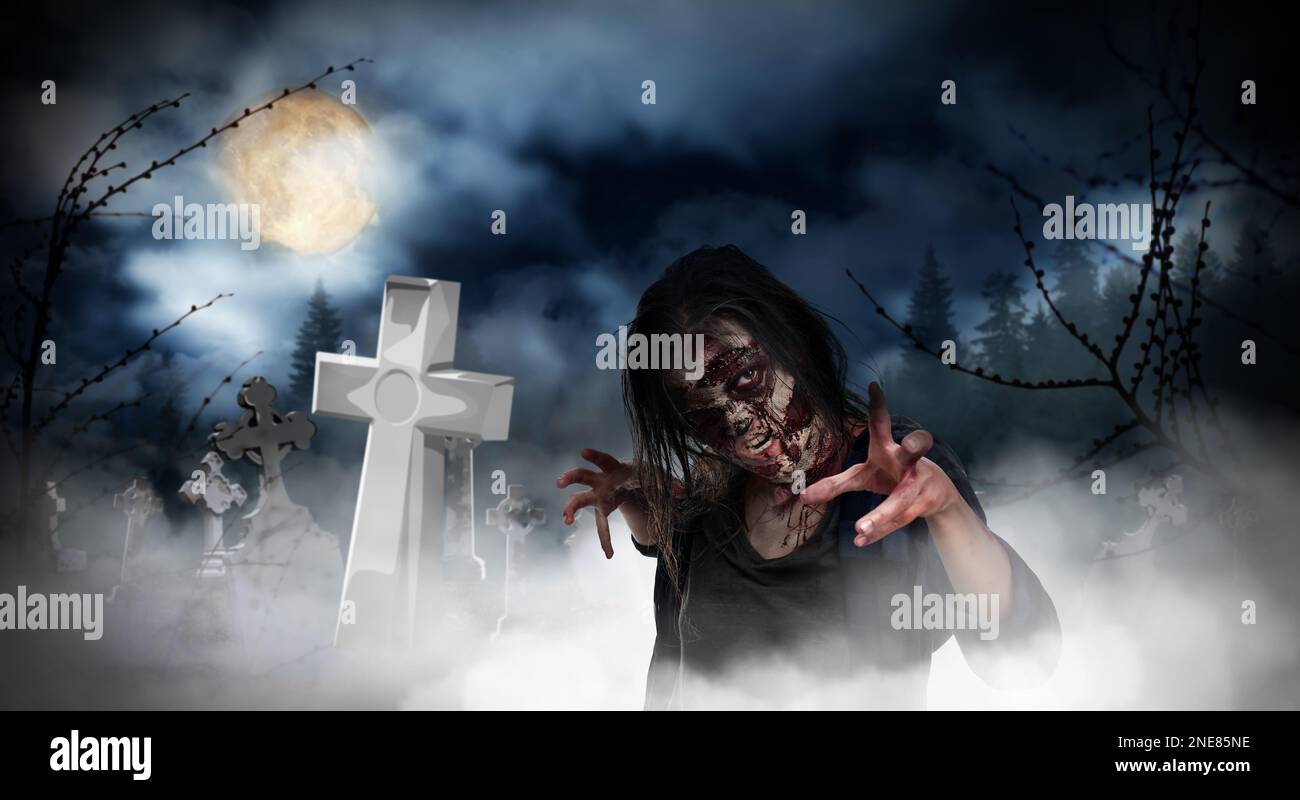 Scary zombie at misty cemetery with old creepy headstones under full ...