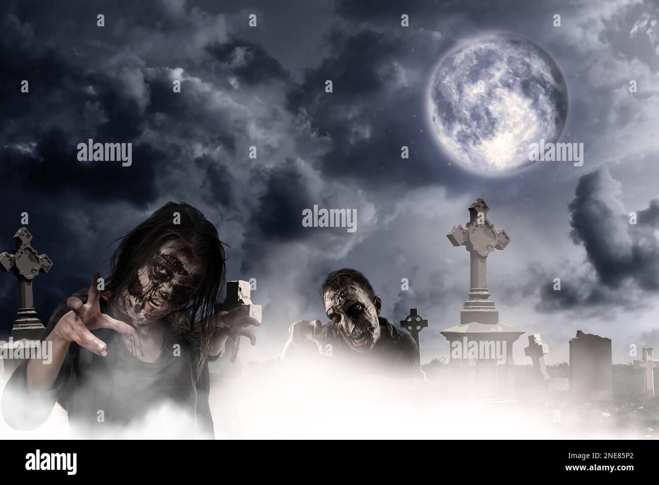 Scary zombies at misty cemetery under full moon. Halloween monster ...