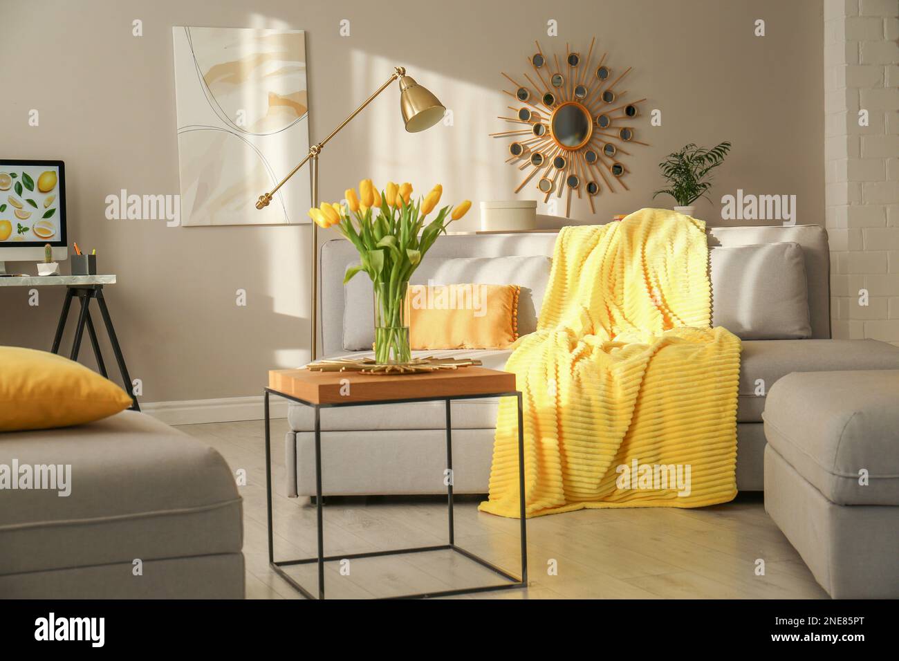 Stylish living room with sofa. Interior design in grey and yellow ...