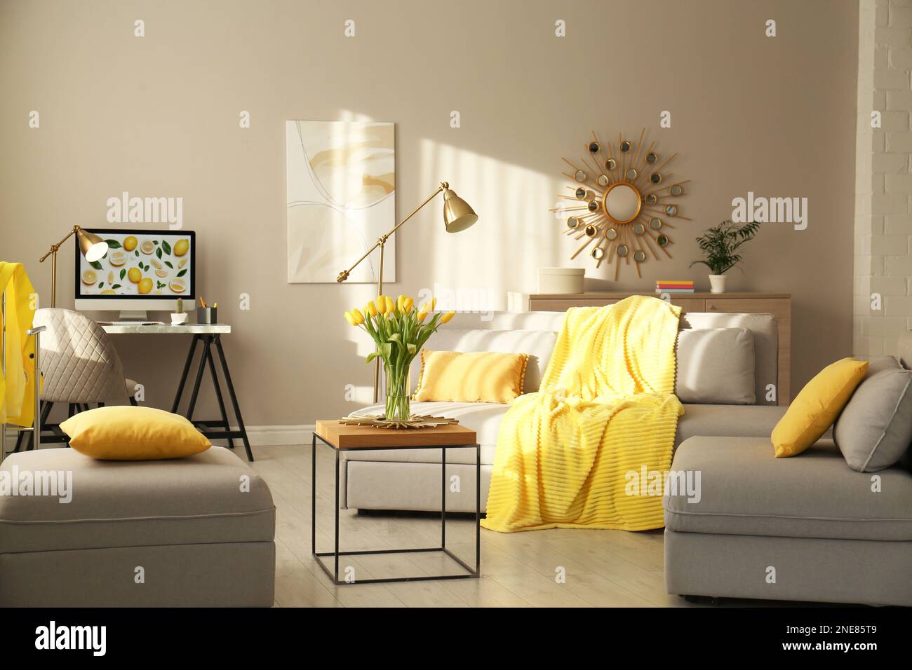 Stylish living room with sofa. Interior design in grey and yellow ...