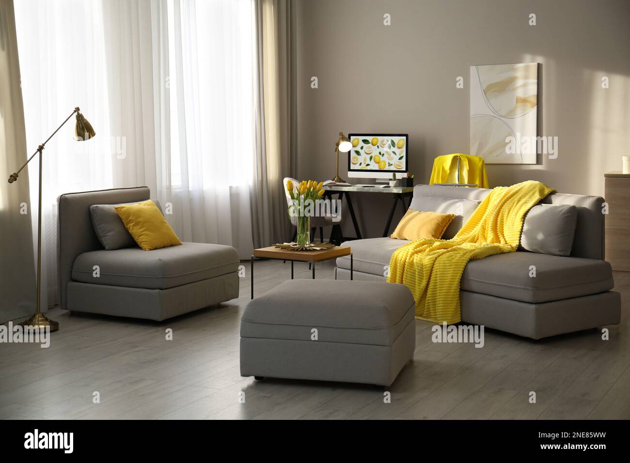 Stylish living room with sofa. Interior design in grey and yellow ...