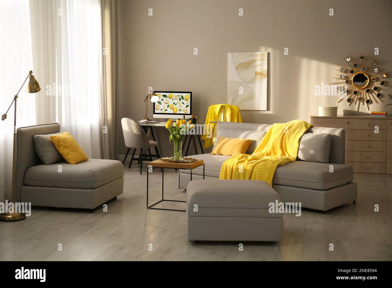 Stylish living room with sofa. Interior design in grey and yellow ...