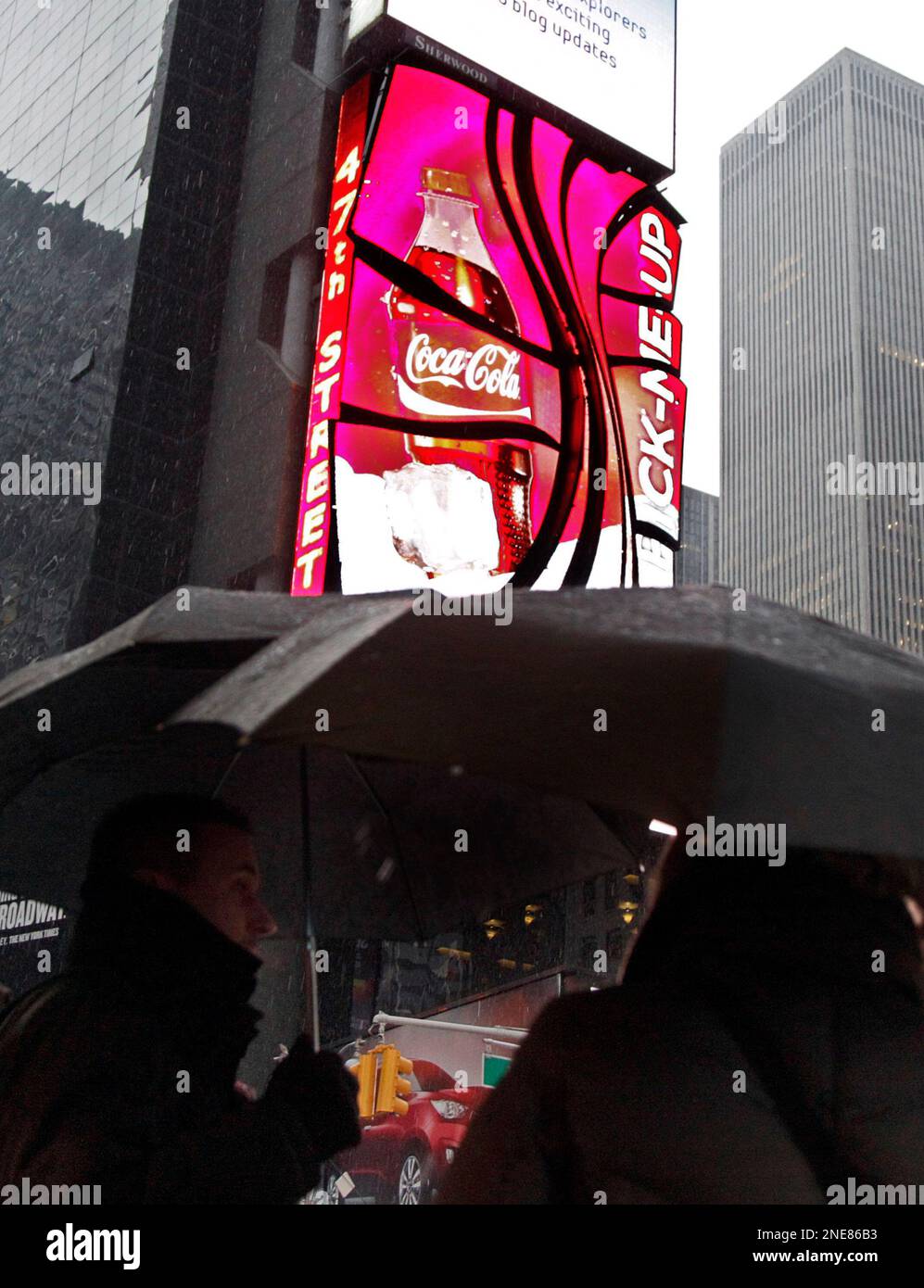 The ubiquitous Coca-Cola billboard lights New York's Times Square ...