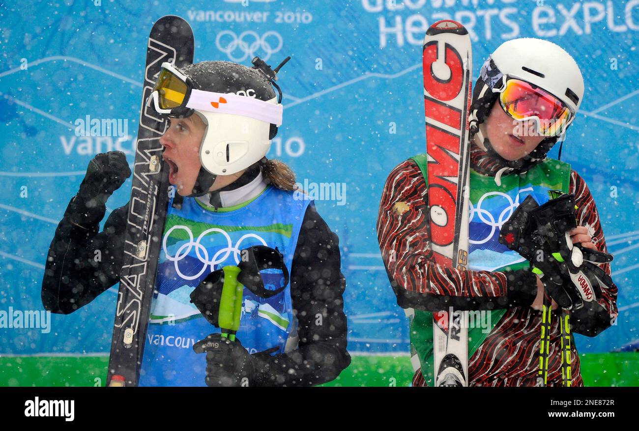 Karin Huttary, left, of Austria reacts as looks on after competing ...