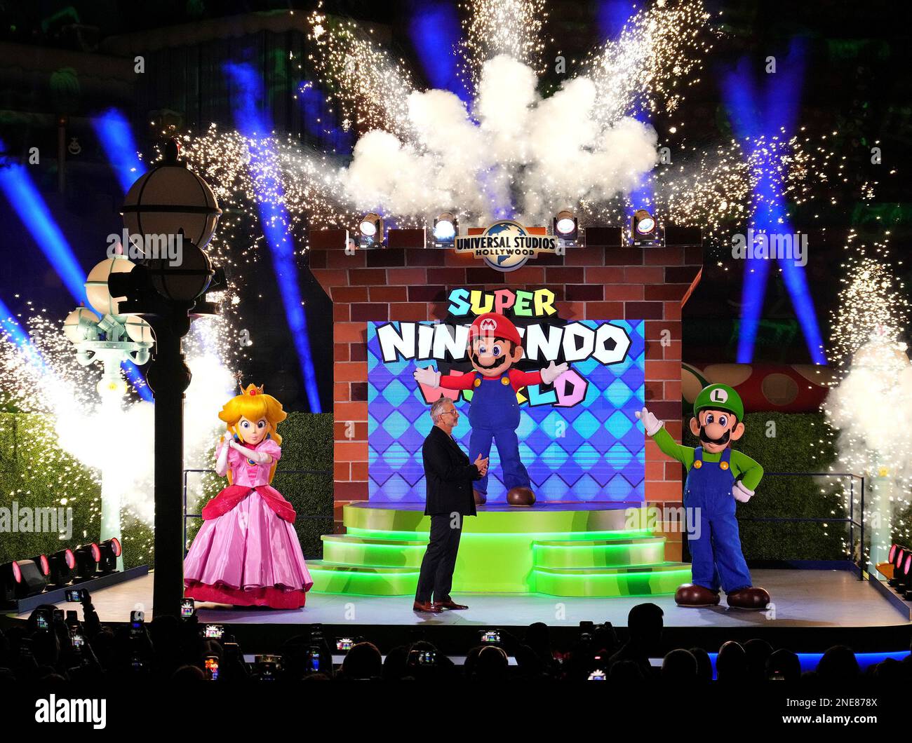 (L-R) Princess Peach, Mark Woodbury, chairman and CEO of Universal ...