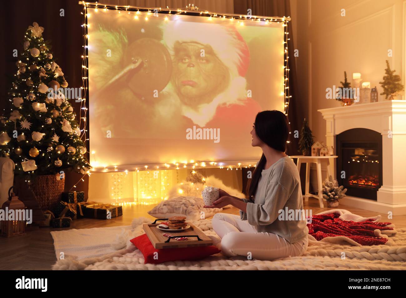 MYKOLAIV, UKRAINE - DECEMBER 24, 2020: Woman watching The Grinch movie ...