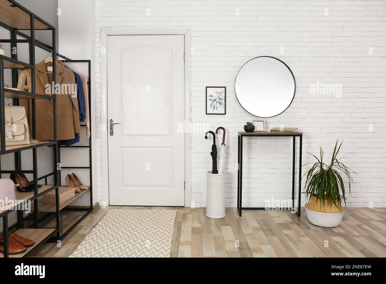 Modern hallway interior with mirror and storage unit Stock Photo - Alamy