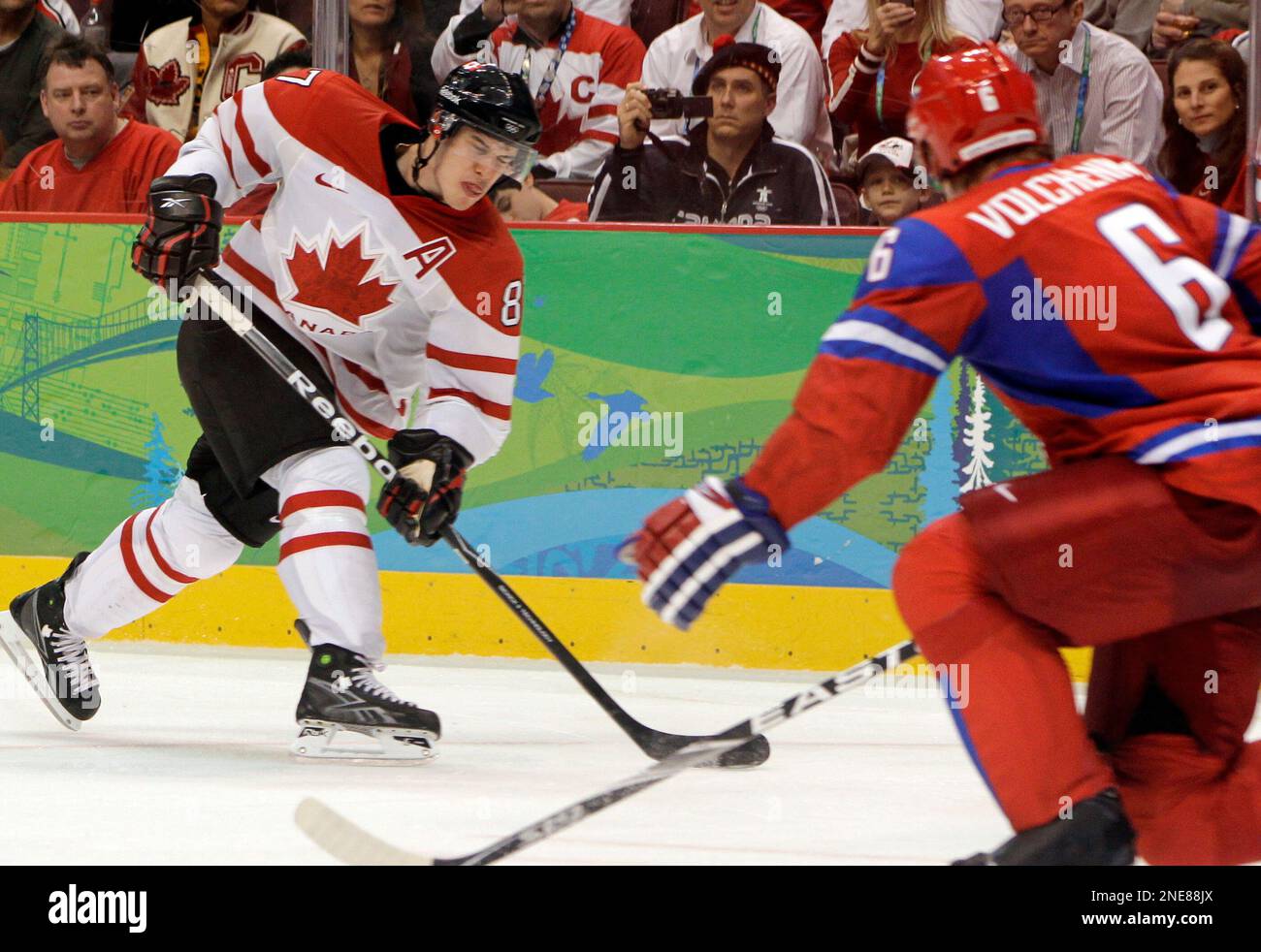 Canada's Sidney Crosby (87) shoots at Russia's Anton Volchenkov (6) in ...