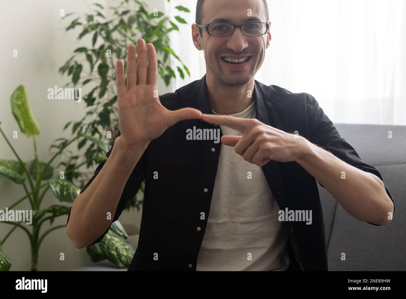 Adult Learning Sign Language For Deaf Disabled Stock Photo - Alamy