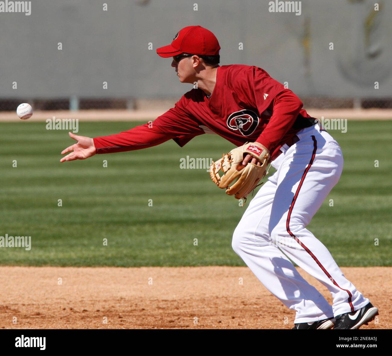 Arizona Diamondbacks infielder Mark Hallberg flips the ball to second ...