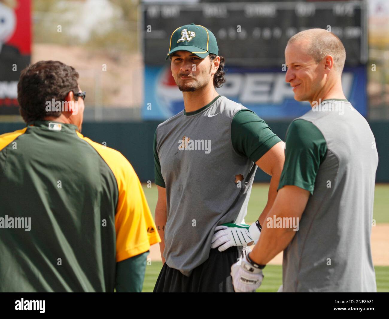 Oakland Athletics infielders Mark Ellis, right, and Eric Chavez, center ...
