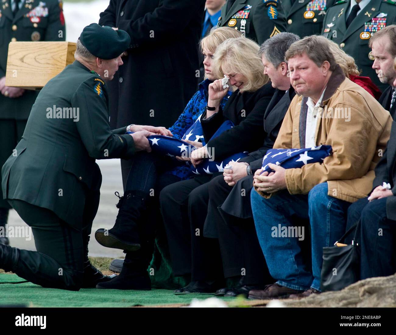 Maj. Gen. Michael Repass, presents a flag to Amber Christian, the widow ...