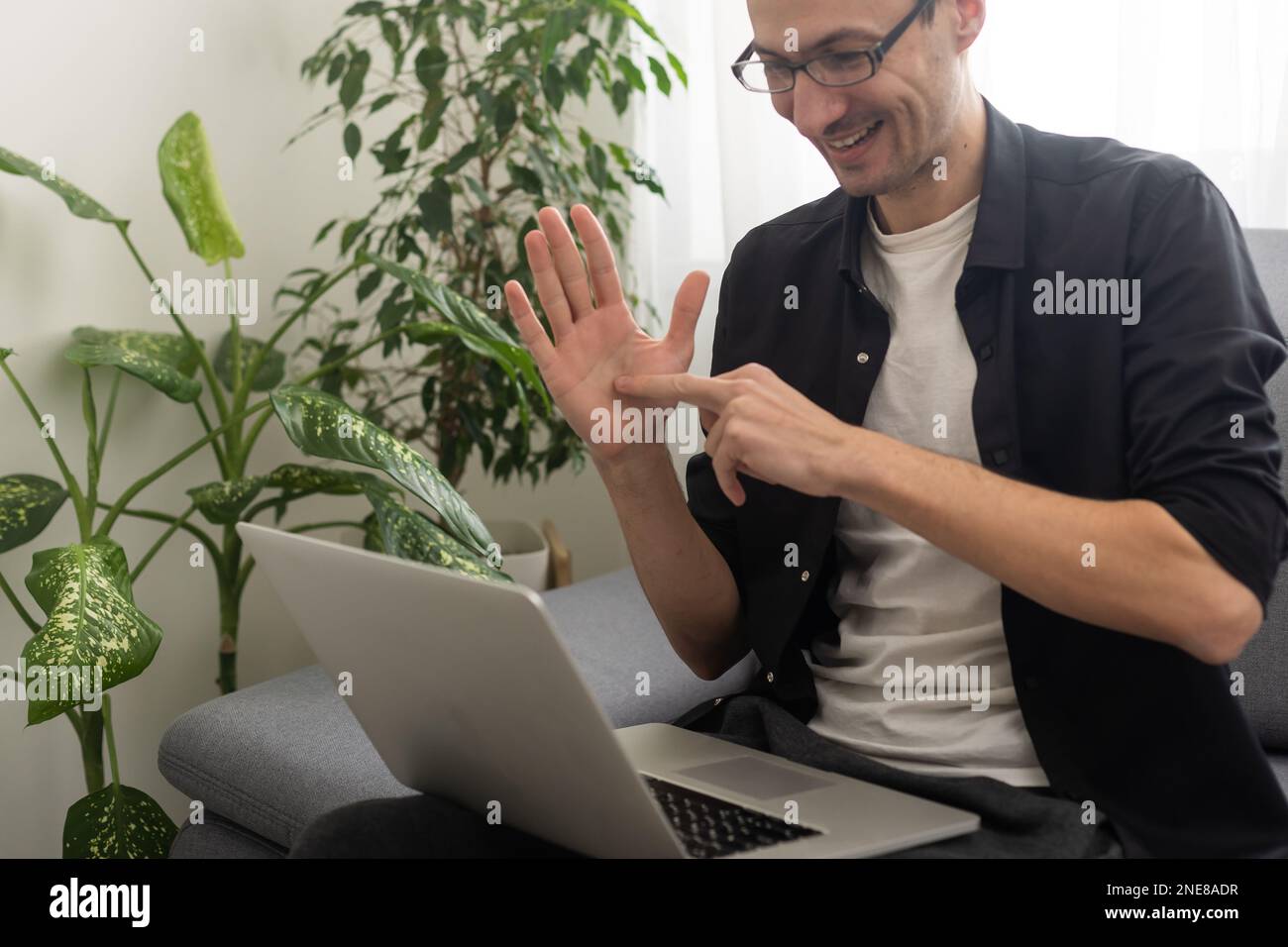 Adult Learning Sign Language For Deaf Disabled Stock Photo - Alamy