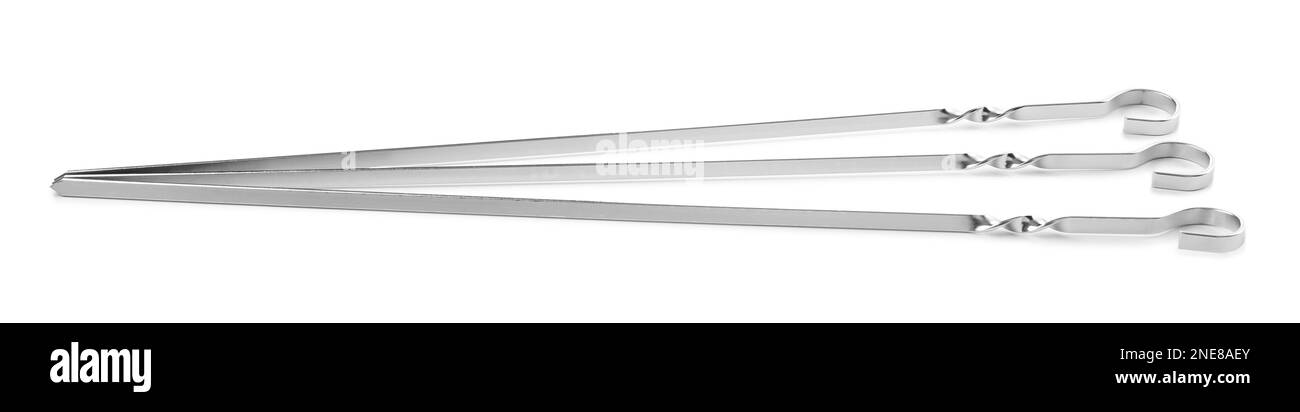 Metal skewers on white background. Barbecue utensil Stock Photo - Alamy