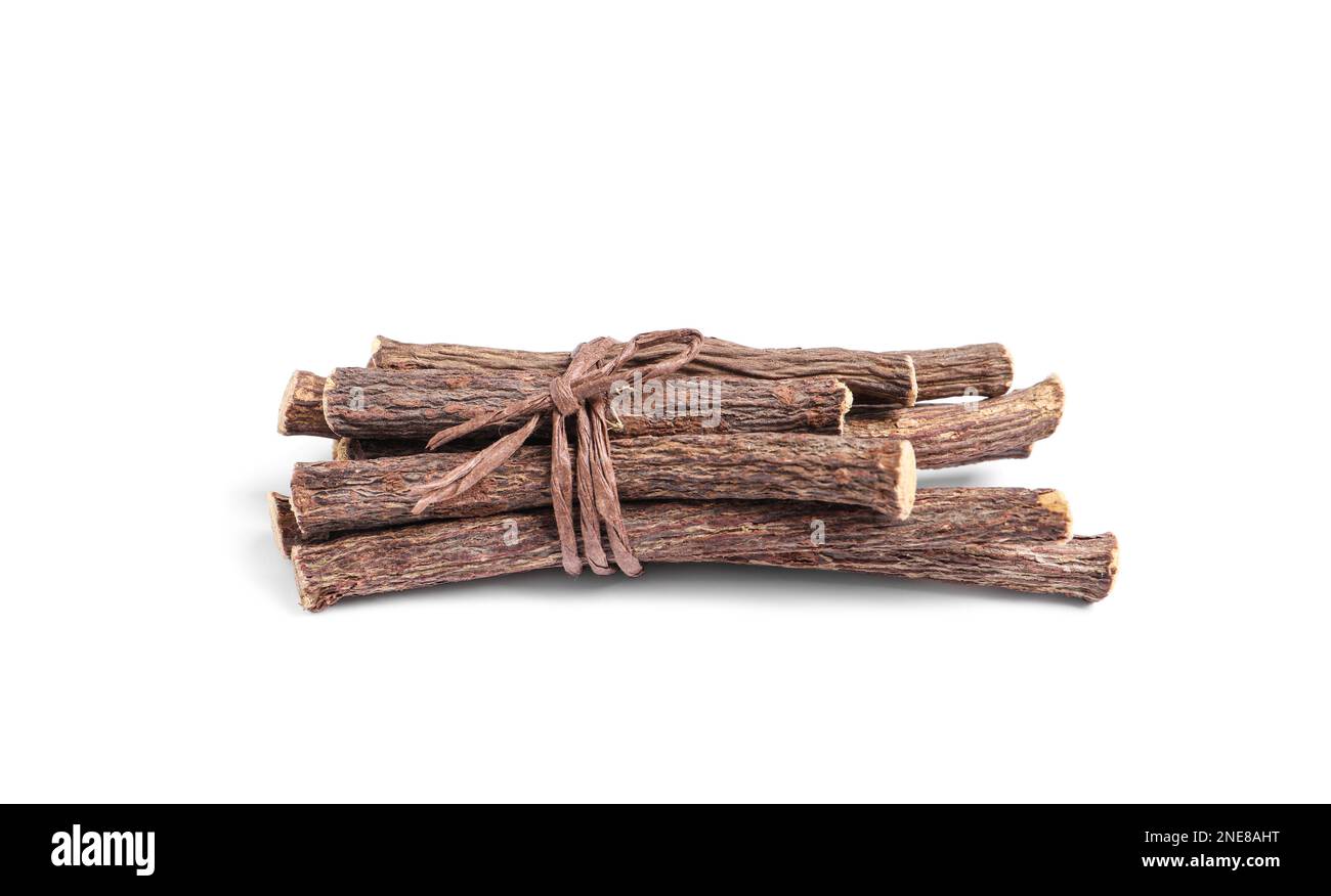 Dried sticks of liquorice root on white background Stock Photo - Alamy