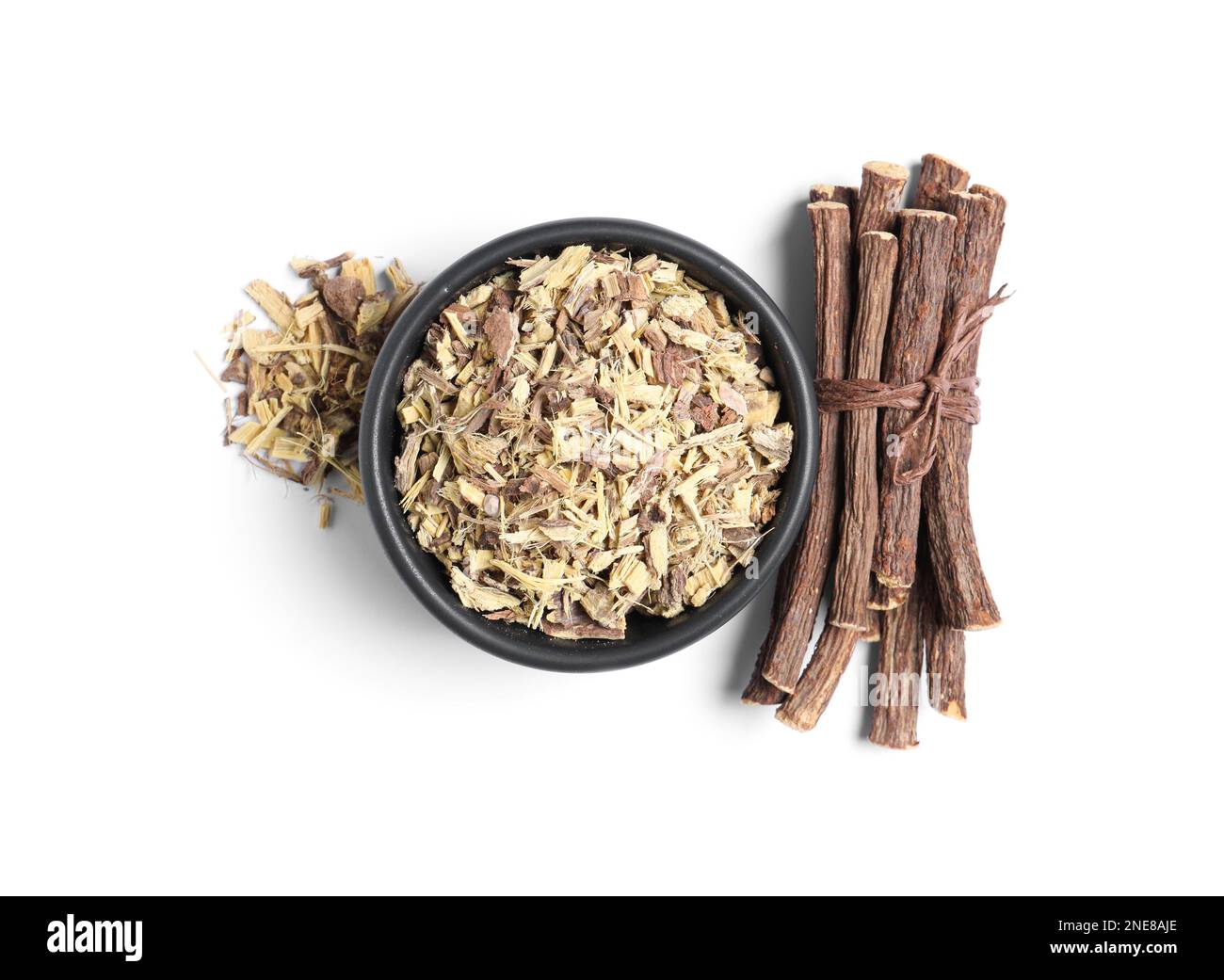 Dried sticks of liquorice root and shavings on white background, top ...