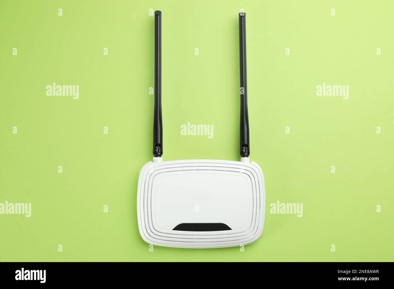 Modern Wi-Fi router on green background, top view Stock Photo - Alamy